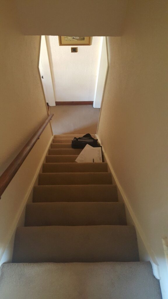 Squeezing a Brooks Stairlift safely onto a narrow steep staircase in a ...
